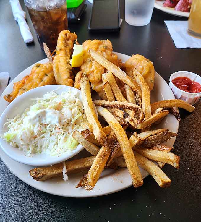Fish and chips done right, with fries that were actual potatoes before someone lovingly cut them by hand, not frozen sadness sticks.