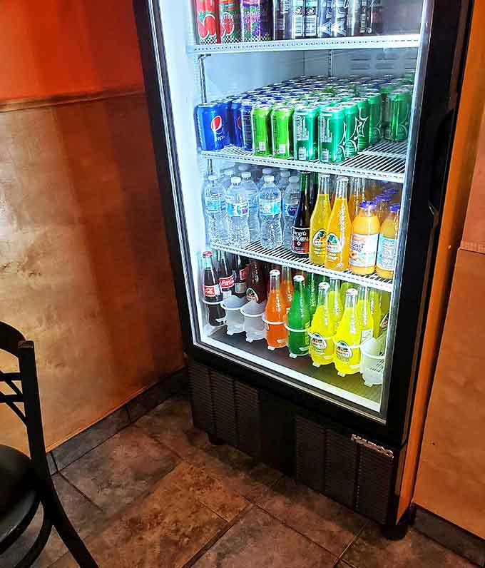 The beverage cooler offers a rainbow of refreshment options, from Mexican sodas to agua frescas that perfectly complement the food.
