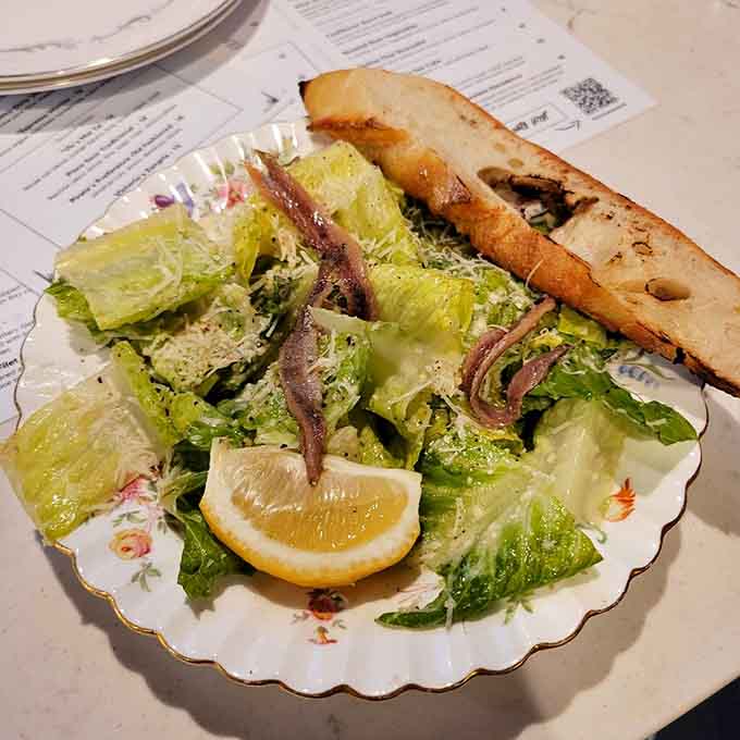 A proper Caesar salad with actual anchovies and grilled bread shows respect for the classics done right.