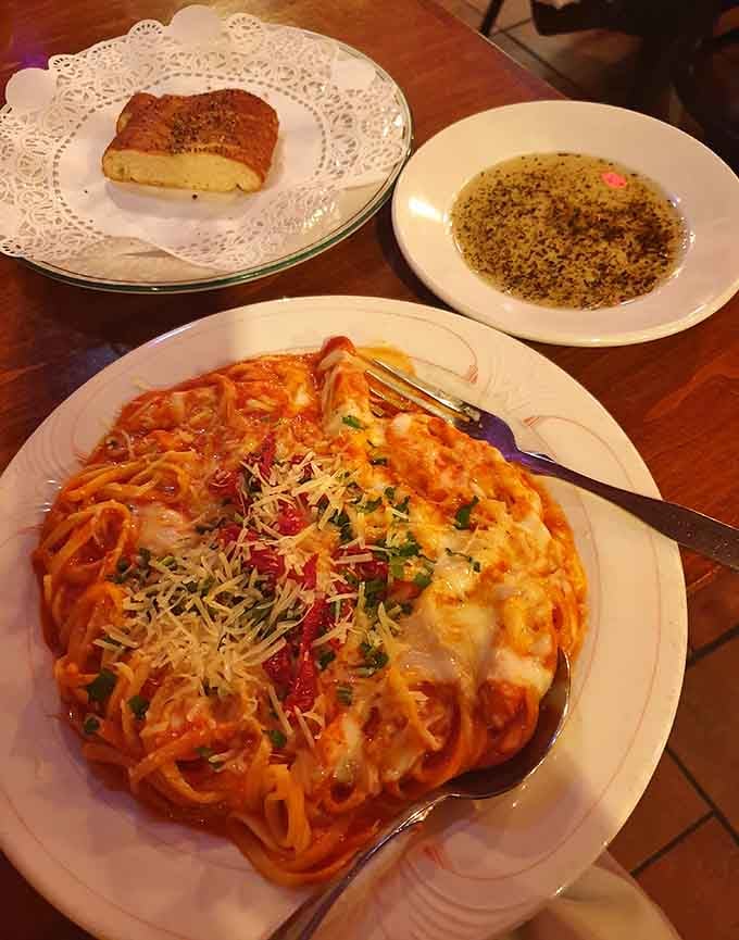 Chicken Parmigiana paired with homemade bread creates the perfect Italian symphony, where every element plays its part in delicious harmony and carb-loaded bliss.
