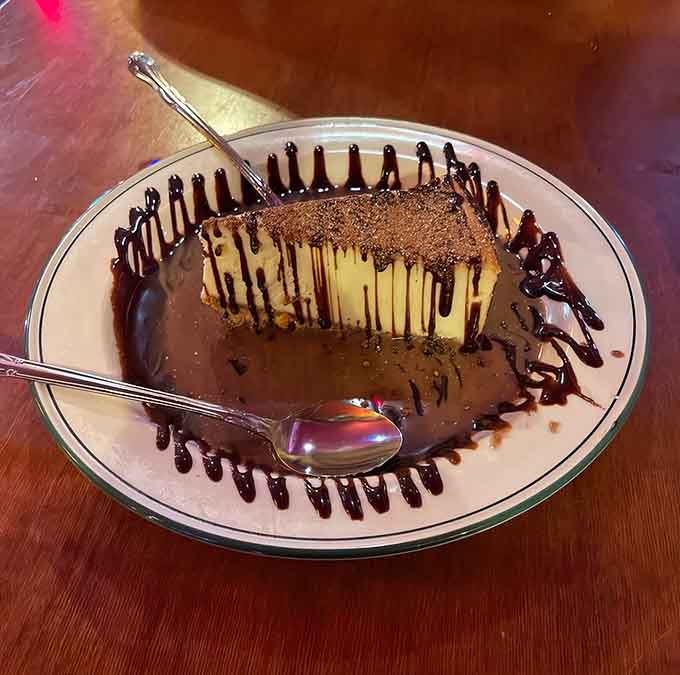 Cheesecake meets cappuccino in this dreamy creation, drizzled with chocolate sauce like edible artwork on your plate.