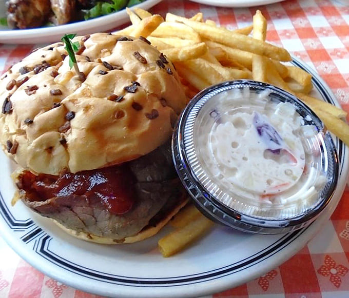 This beef brisket sandwich comes with crispy fries and creamy coleslaw, proving that good things really do come in threes.