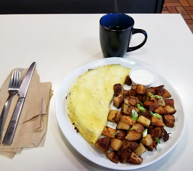 The Meaty Omelet doesn't just satisfy hunger – it abolishes it, with home fries that could make a potato farmer weep with pride.