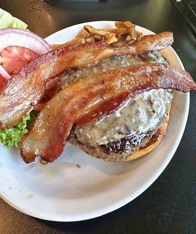 This burger wears its bacon like a crown, proving that Mooselook's lunch game is just as strong as breakfast.