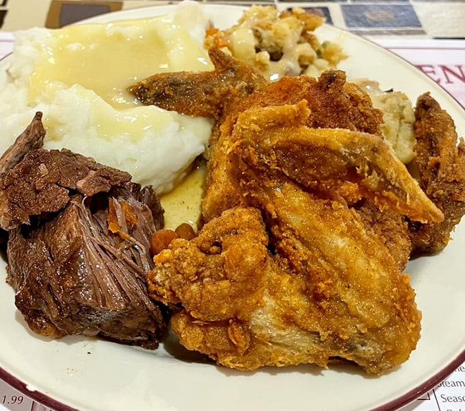 This dinner plate showcases the beautiful chaos of a buffet visit, where decision-making skills go out the window deliciously.