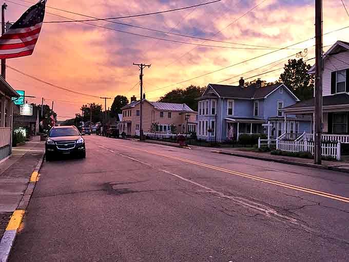 Sunset paints Waynesville's residential street in cotton candy hues, transforming ordinary homes into a Norman Rockwell scene come to life.
