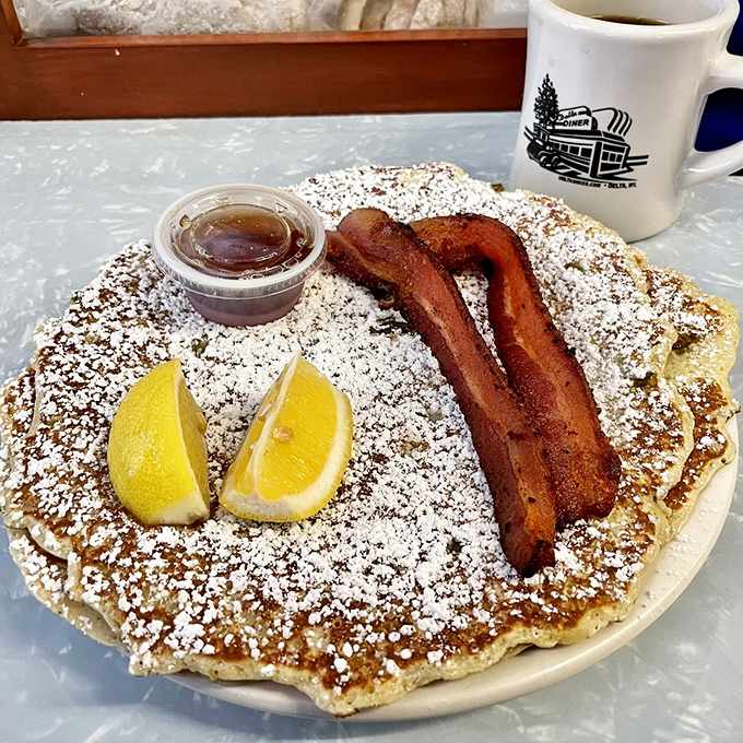 The classic breakfast trinity: golden pancakes, perfectly crisped bacon, and that first sip of steaming coffee.