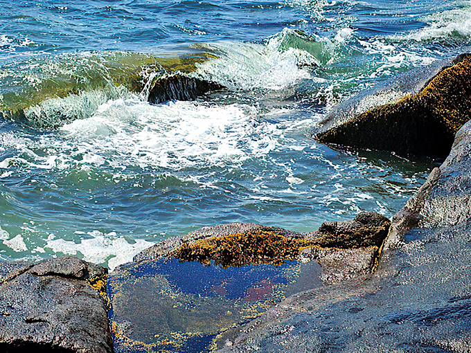 Atlantic waves crash against ancient granite, creating nature's own percussion section in this coastal symphony.