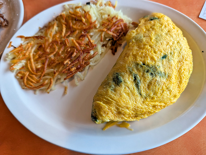 An omelet that defies physics &ndash; somehow both substantial and light, filled with fresh ingredients and paired with perfectly crispy hash browns.