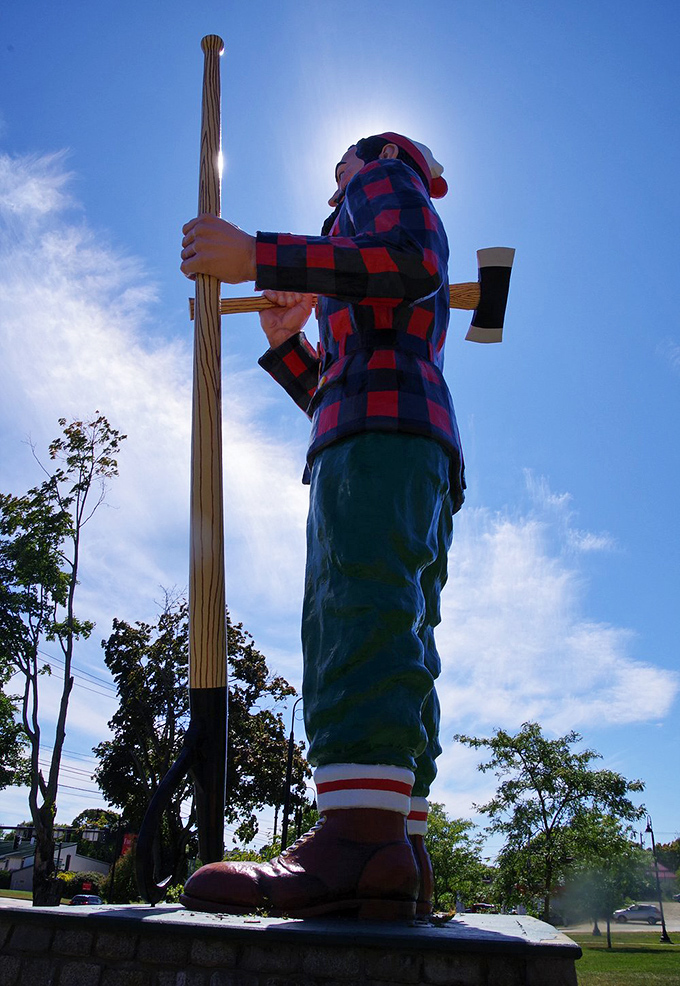 Against puffy white clouds, our folkloric friend seems ready to reach up and rearrange the sky &ndash; just another day's work for America's most famous logger.