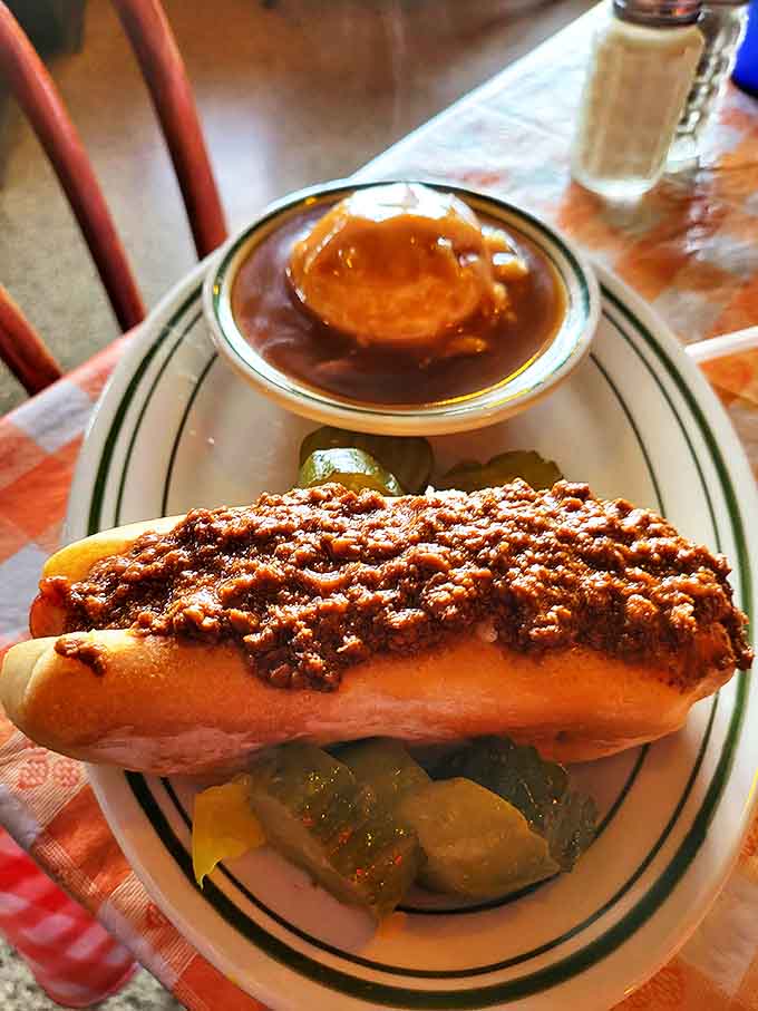 A symphony of flavors on a plate &ndash; the hot dog and its sauce playing the lead while mashed potatoes provide the comforting backup vocals.