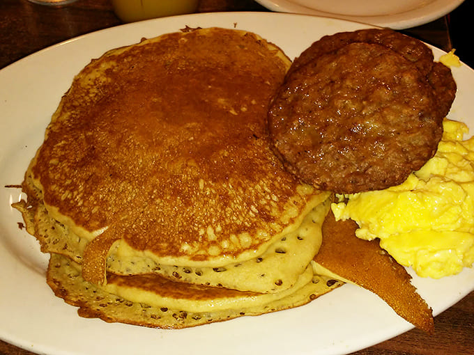 Stack attack! These golden pancakes achieve the impossible balance of fluffy yet substantial, paired with a sausage patty that means business.