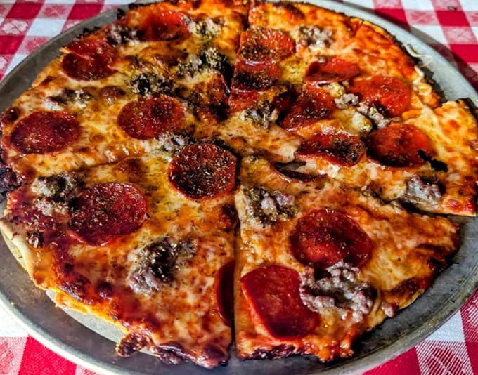 Classic pepperoni pizza with those curled edges creating little cups of spicy goodness, simple perfection that needs no apology.