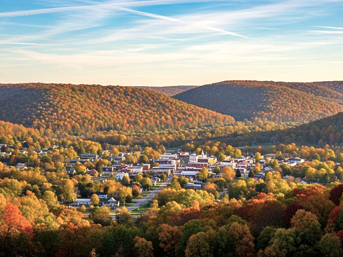 Autumn transforms these hills into nature's most spectacular paint job, no filter needed for this view.