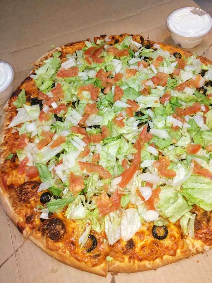 Loaded with fresh vegetables and olives, this pizza proves that eating your greens can be delicious when cheese is involved.