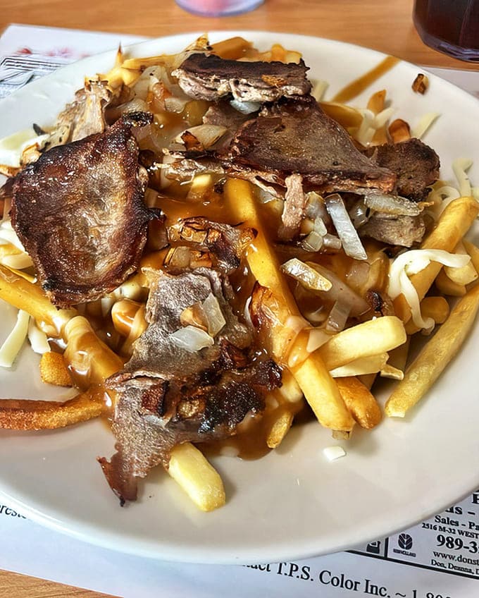 Poutine Danis Way: Michigan's delicious interpretation of Canadian comfort food &ndash; those tender steak slices elevate this from mere fries to a full-fledged celebration.