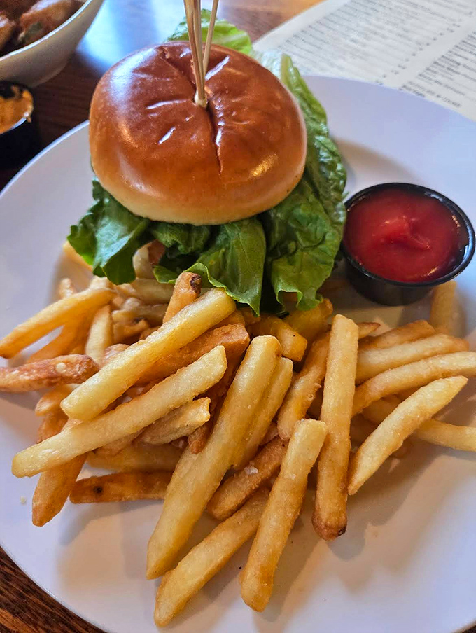 This isn't just any burger &ndash; it's a hand-formed masterpiece on a toasted bun with crispy fries that'll make you forget all other potatoes.