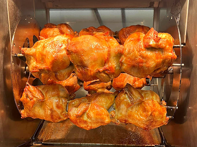 Golden rotisserie chickens spinning like delicious disco balls, ready to make your dinner plans infinitely easier.