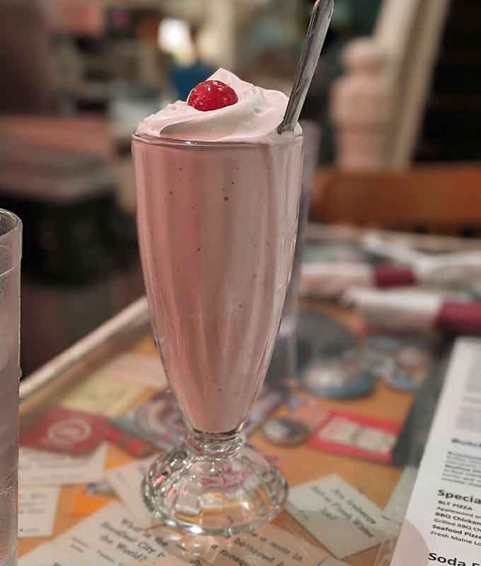 Thick enough to require a spoon and a strategy, this strawberry shake is what happens when ice cream gets serious about its job.