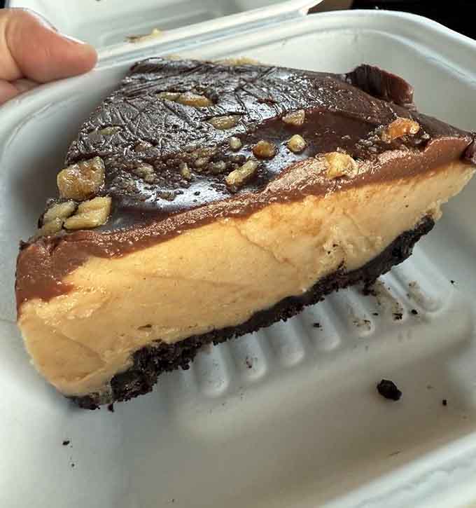 Peanut butter and chocolate in cream pie form, basically childhood nostalgia elevated to gourmet status with whipped cream on top.