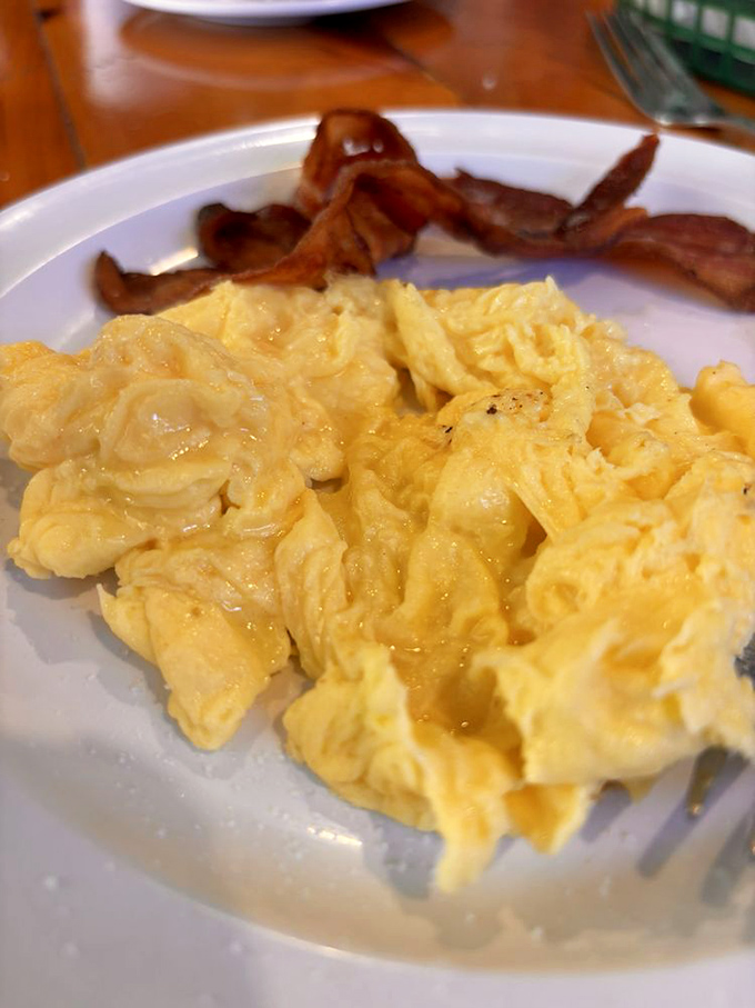 Scrambled eggs and bacon Fluffy clouds of perfectly scrambled eggs alongside bacon that's achieved the holy grail: crisp yet tender. Breakfast nirvana achieved.