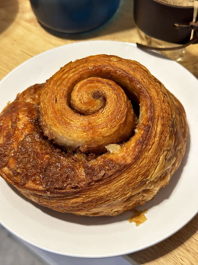 That cinnamon roll's hypnotic spiral of buttery layers could put you in a trance, and honestly, that's not the worst place to be.