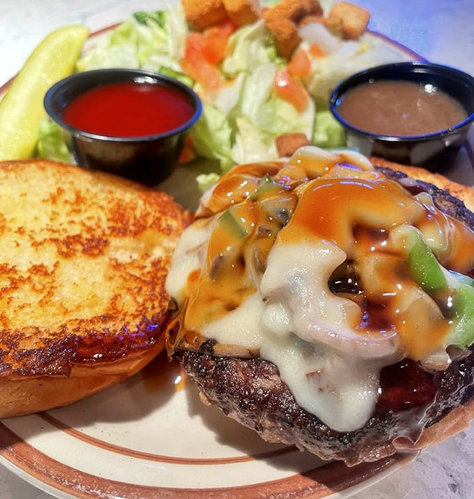 The teriyaki burger glistens with glaze and melted cheese, delivering sweet and savory flavors in every magnificent bite.