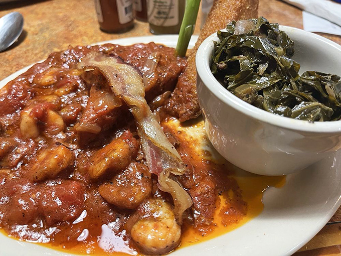Southern harmony on a plate &ndash; shrimp and grits with collard greens. The kind of meal that makes you want to hug the chef and steal their recipe.