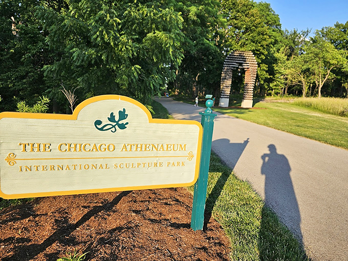 Welcome to where art meets nature&mdash;the park's entrance sign promises adventures that lie just beyond the bend.