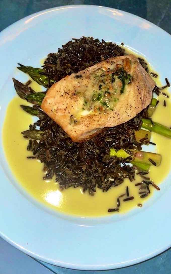 Wild rice provides the perfect Minnesota foundation for this seafood masterpiece topped with vibrant pomegranate.