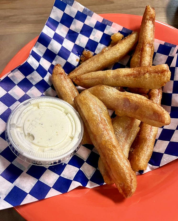 Golden, crispy Spam fries &ndash; the unexpected delicacy that converts skeptics into evangelists with just one dip in that creamy sauce.