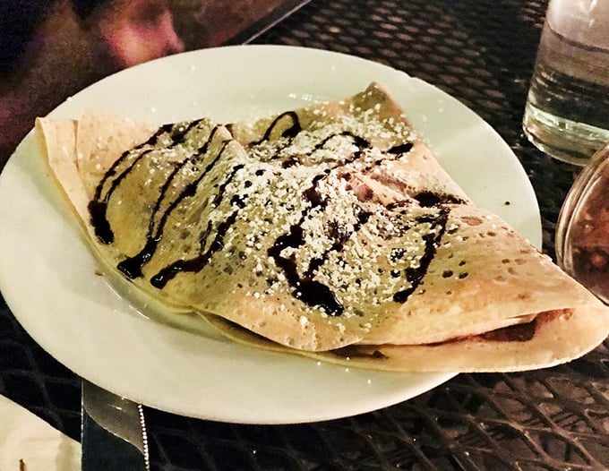 Strawberry Nutella Crepe: A delicate pancake envelope delivering the perfect marriage of hazelnut-chocolate spread and fresh strawberries &ndash; nature's most inspired partnership.