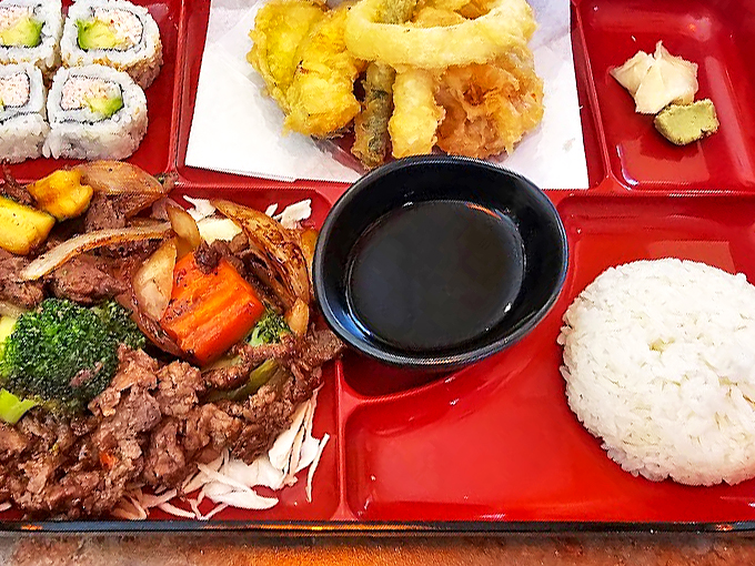 A feast for the eyes and the stomach! This bento box is like a treasure chest of flavors, each compartment a delicious surprise.