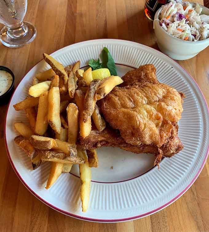 That fish and chips combo delivers the perfect crunch-to-fluff ratio that makes British pub food jealous.