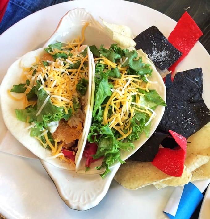 Perch tacos bring a playful twist to Midwest fish fry traditions, colorful and fresh as a summer day.