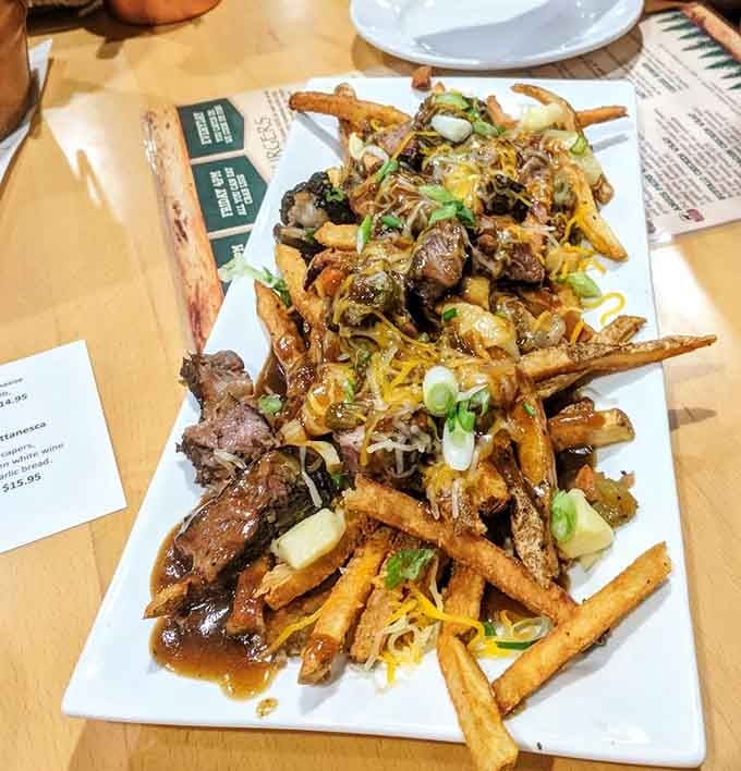 When fries meet gravy, cheese, and tender meat, you get poutine that makes you understand why Canadians won't shut up about it.