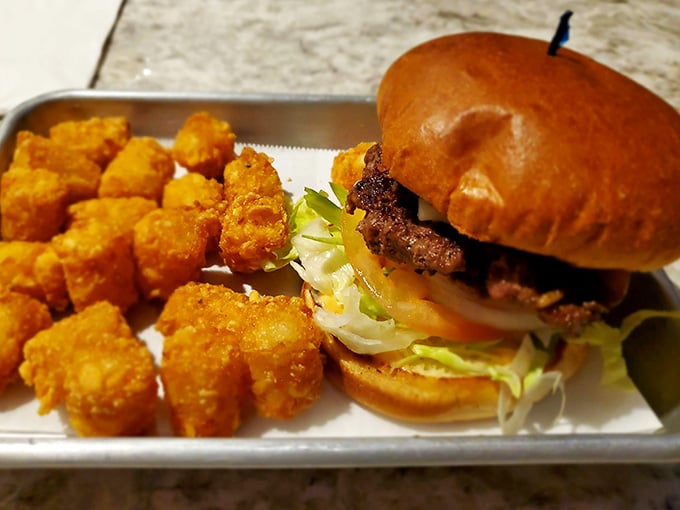 Another angle on burger perfection, this time with those addictive tater tots that make choosing sides delightfully difficult.