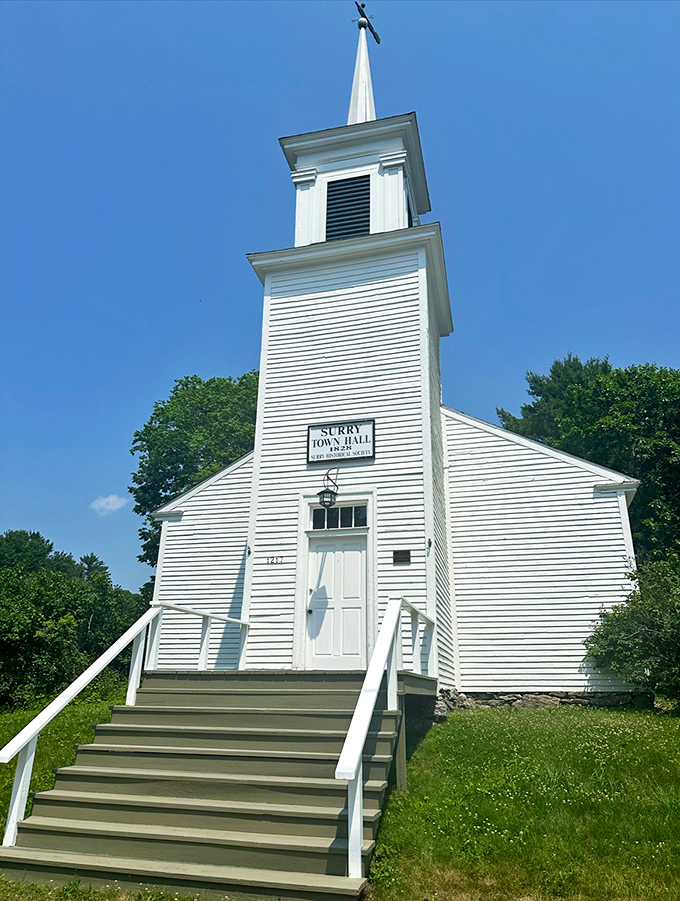 The historic Surry Town Hall stands proudly against blue skies, a testament to small-town governance and community.
