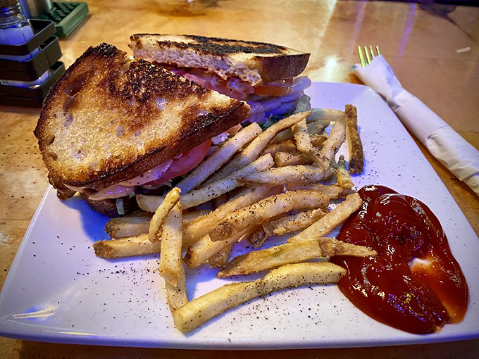 The turkey club sandwich achieves the impossible &ndash; perfectly toasted bread, flavorful meat, and that magical ratio of ingredients that prevents mid-bite collapse.