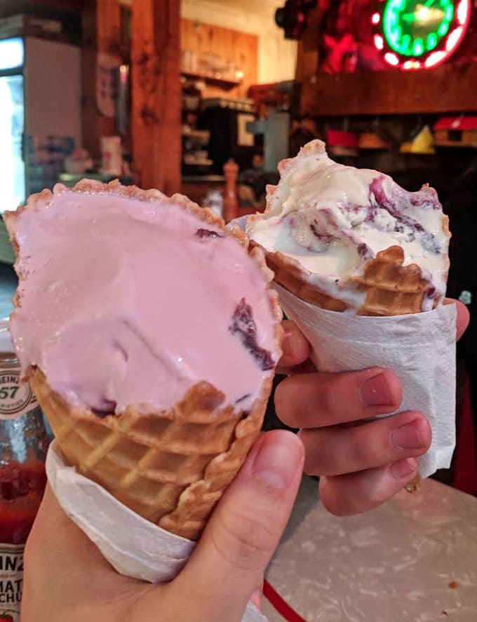 Two waffle cones loaded with colorful scoops prove that some architectural marvels are meant to be eaten, not just admired.