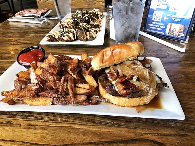 The legendary Whiskey Burger arrives with hand-cut fries that deserve their own fan club &ndash; crispy, seasoned perfection alongside that glorious sandwich.