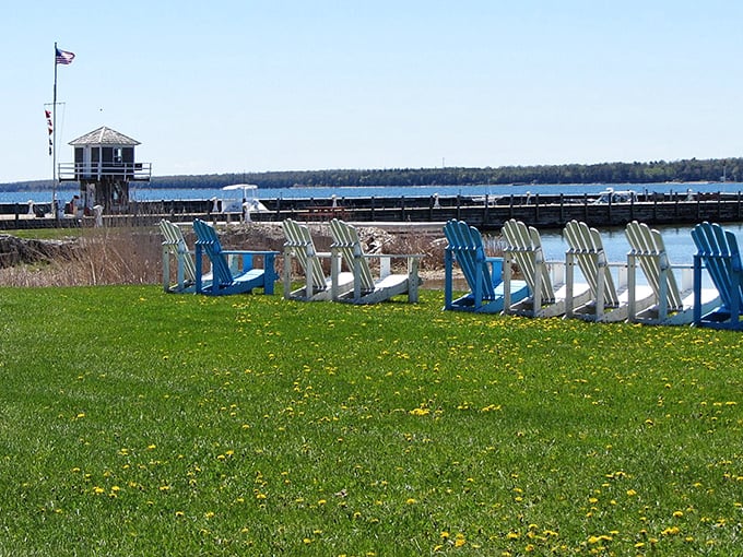 Colorful Adirondack chairs invite visitors to pause and soak in harbor views, a quintessential Door County relaxation station.