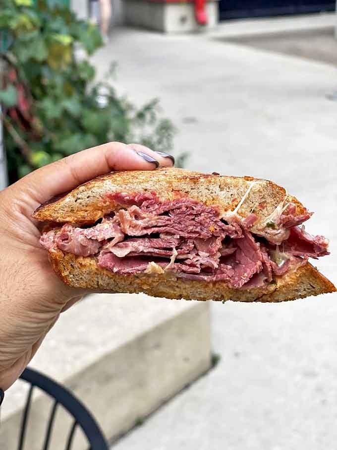 The legendary Zingerman's Reuben &ndash; where house-made corned beef, Swiss cheese, and sauerkraut achieve a harmony so perfect it deserves its own musical notation.