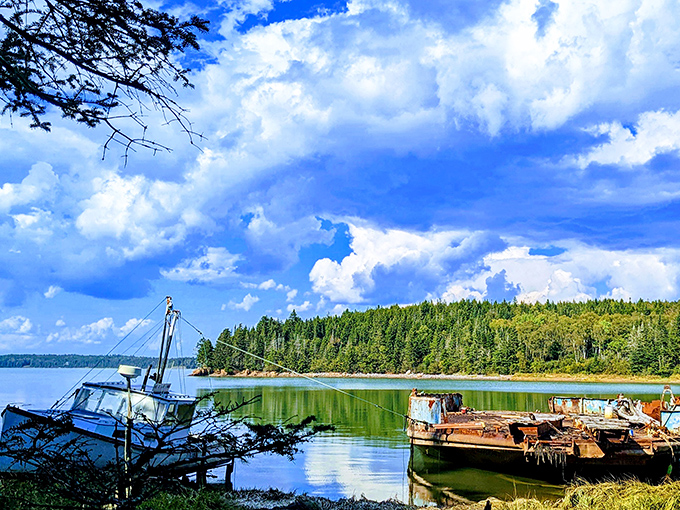 Weathered boats rest against the shoreline, telling silent stories of countless fishing expeditions and maritime adventures.