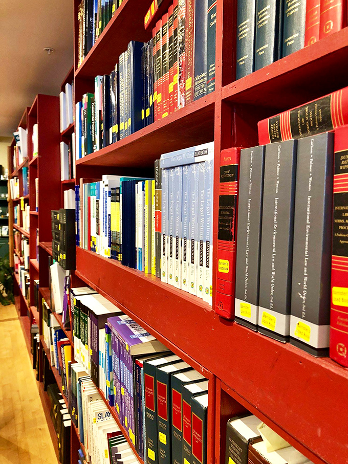 Law books and literature coexist in perfect harmony on these crimson shelves &ndash; a rainbow of knowledge waiting to be discovered.