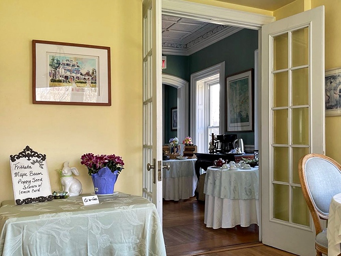Sunlight streams through tall windows, transforming the breakfast room into a stage where morning meals become memorable performances.