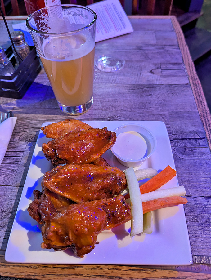 These buffalo wings aren't messing around &ndash; crispy, saucy, and served with the cooling relief of fresh veggies and blue cheese dressing.