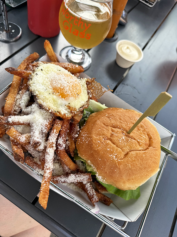 The ultimate Vermont comfort food combo &ndash; a juicy burger alongside truffle fries dusted with parmesan, creating a symphony of flavors that locals drive hours to experience.