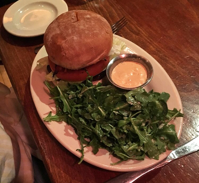 A burger that comes with greens isn't just lunch &ndash; it's practically a health food! At least that's what you'll tell yourself after devouring it.