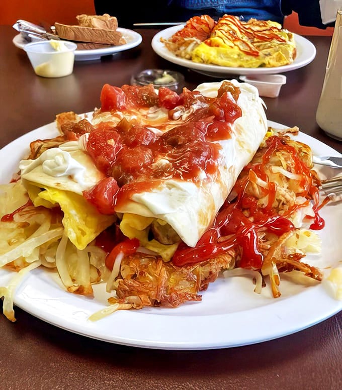 Breakfast meets lunch in this overstuffed burrito &ndash; a tortilla-wrapped treasure chest of eggs, hash browns and melty cheese topped with fresh salsa.